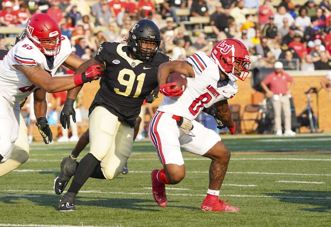 NCAAF News: No. 19 Wake Forest stops Liberty's 2-point play to prevail ...