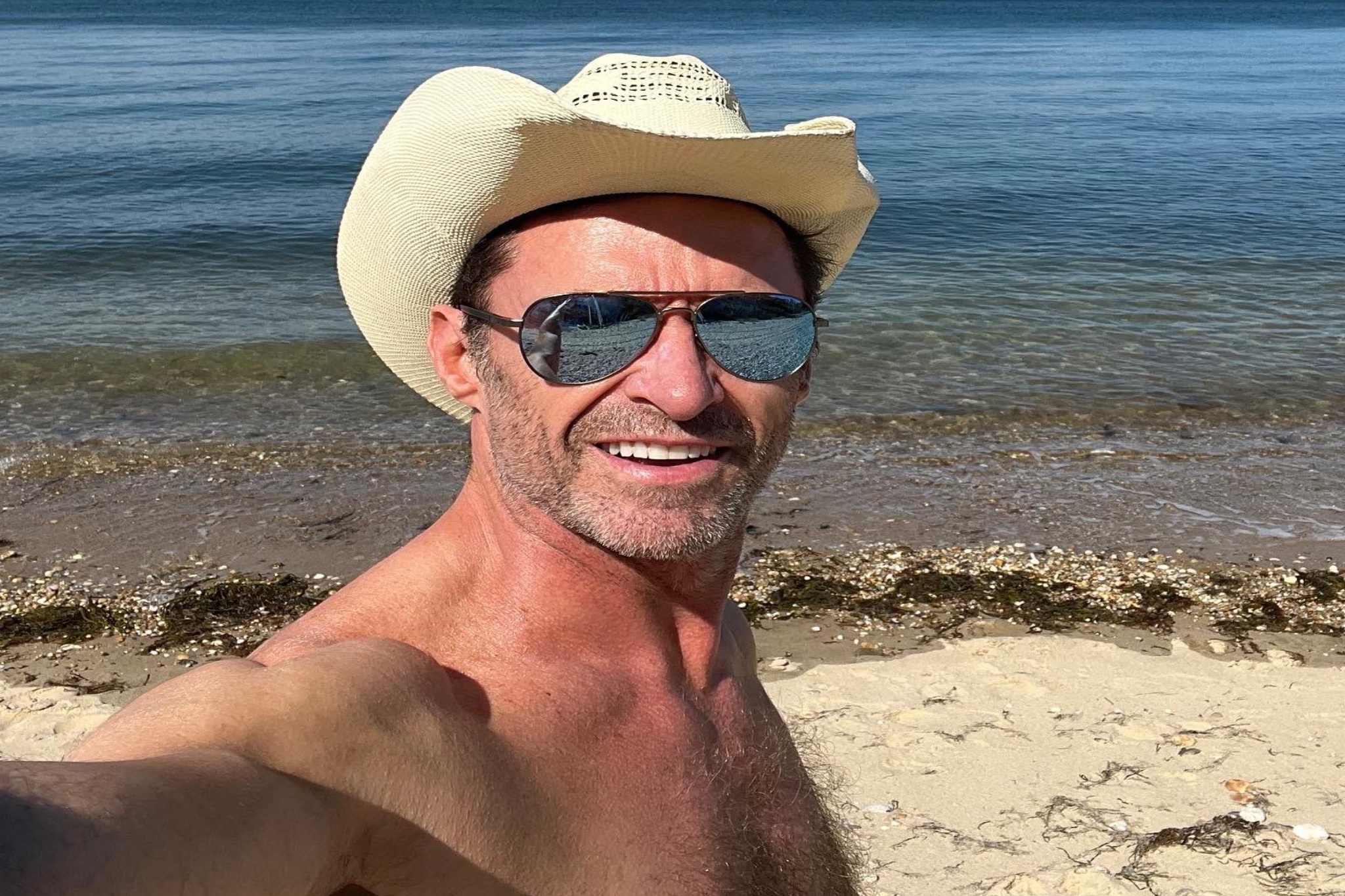 Celebrity Hugh Jackman bares chest, wears cowboy hat, goes swimming ...